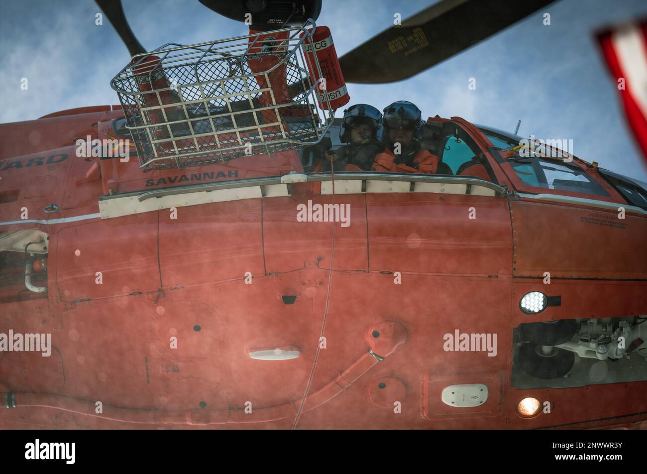 A U.S. Coast Guard Eurocopter MH-65 Dolphin Helicopter crew from Air ...