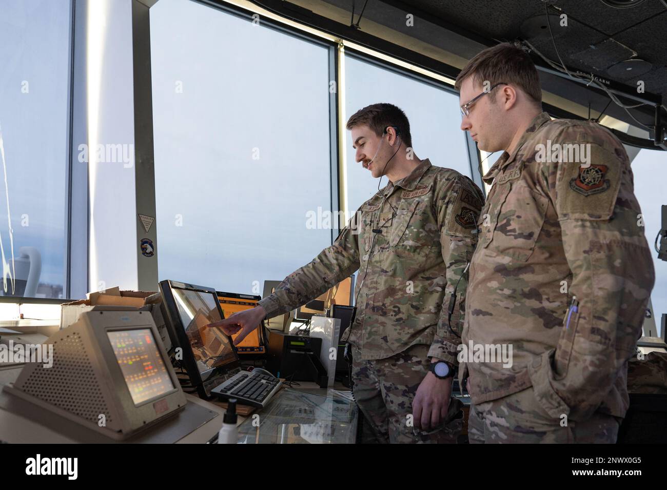 U.S. Air Force Senior Airman Brent Kyzar (left) and Staff Sgt. Yegar ...