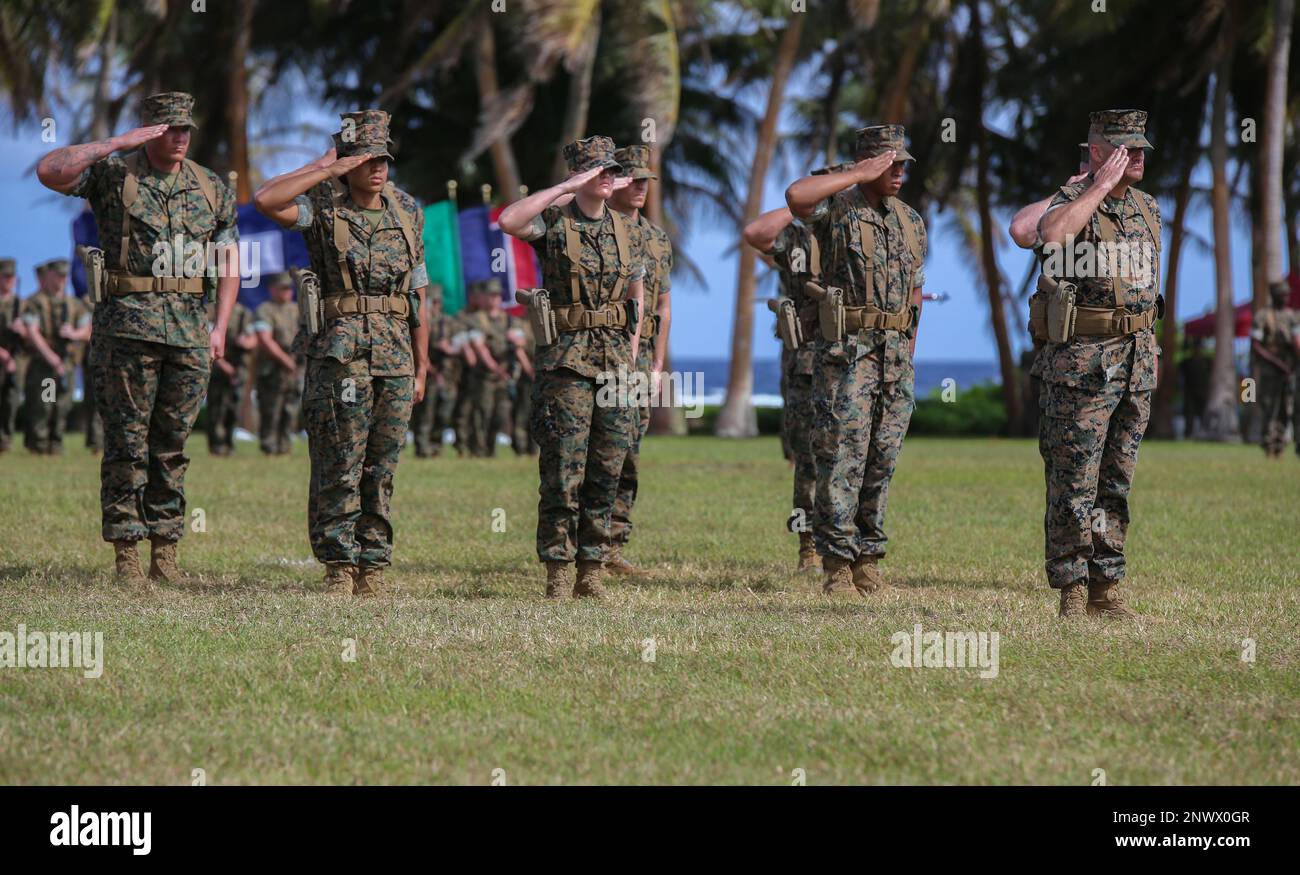 U.S. Marines render a salute during the Marine Corps Base (MCB) Camp ...