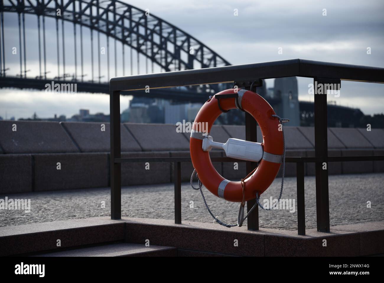Life raft ring in front of Sydney Harbor Bridge Stock Photo - Alamy