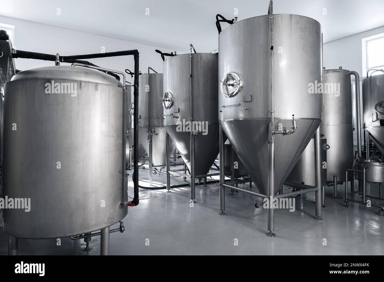 interior of a modern factory brewery with tanks inside Stock Photo - Alamy