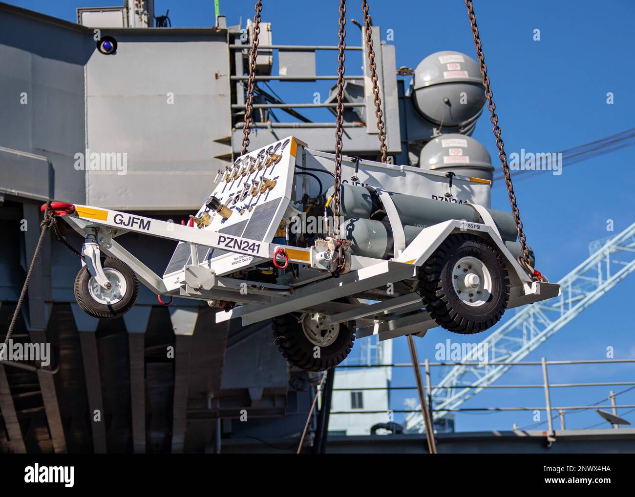 Nitrogen carts are loaded aboard the Nimitz-class aircraft carrier USS ...