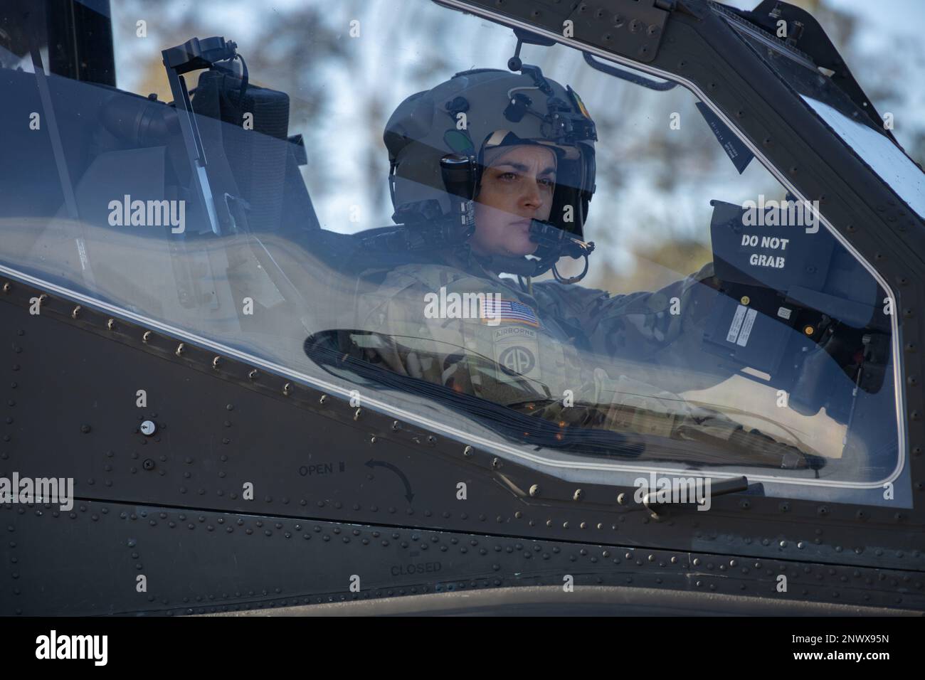 A U.S. Army AH-64 Apache pilot waits for her aircraft to be refueled on ...