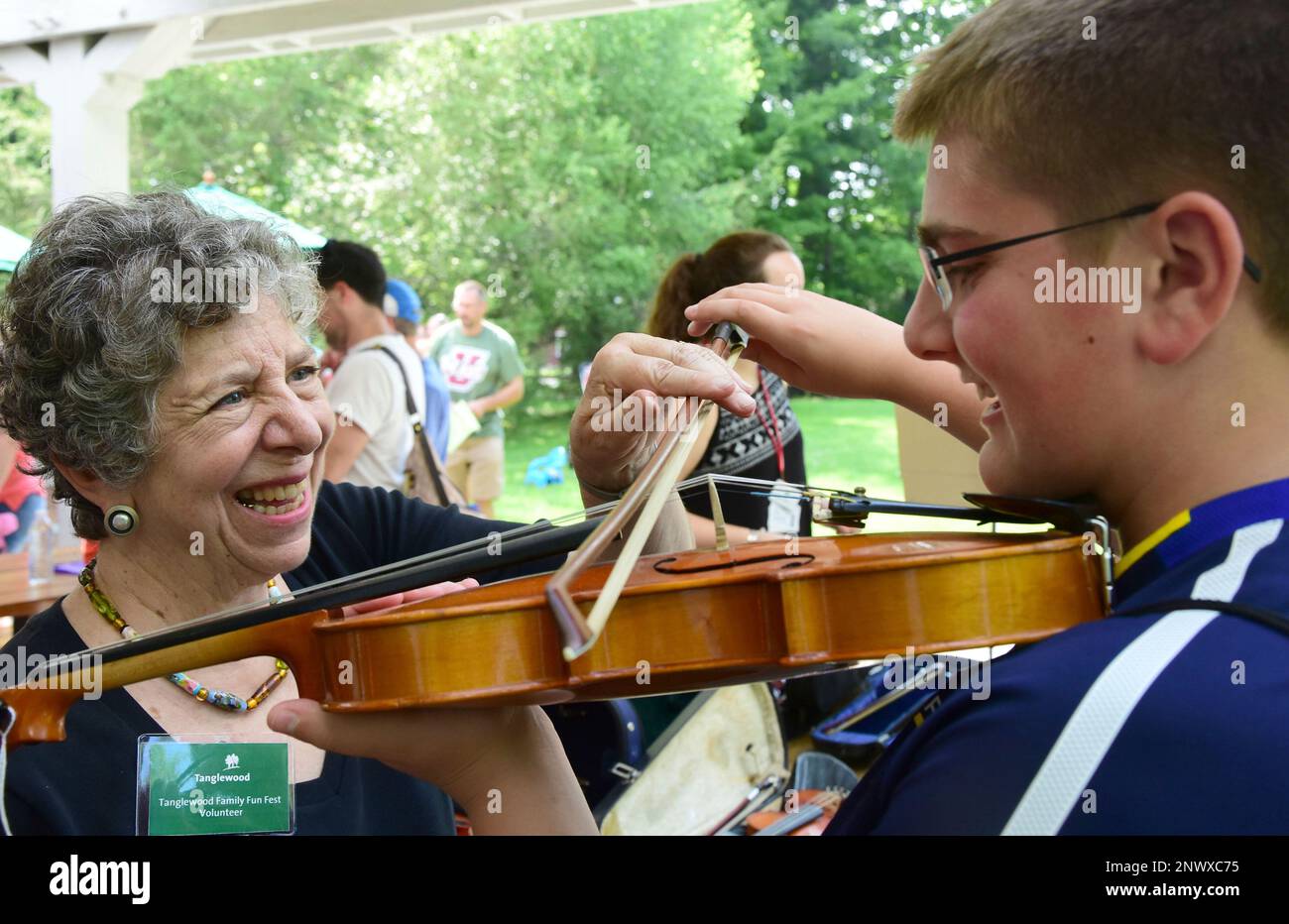 Nick Jakoulov, 11, of Athol, Mass. plays a violin with some help from ...