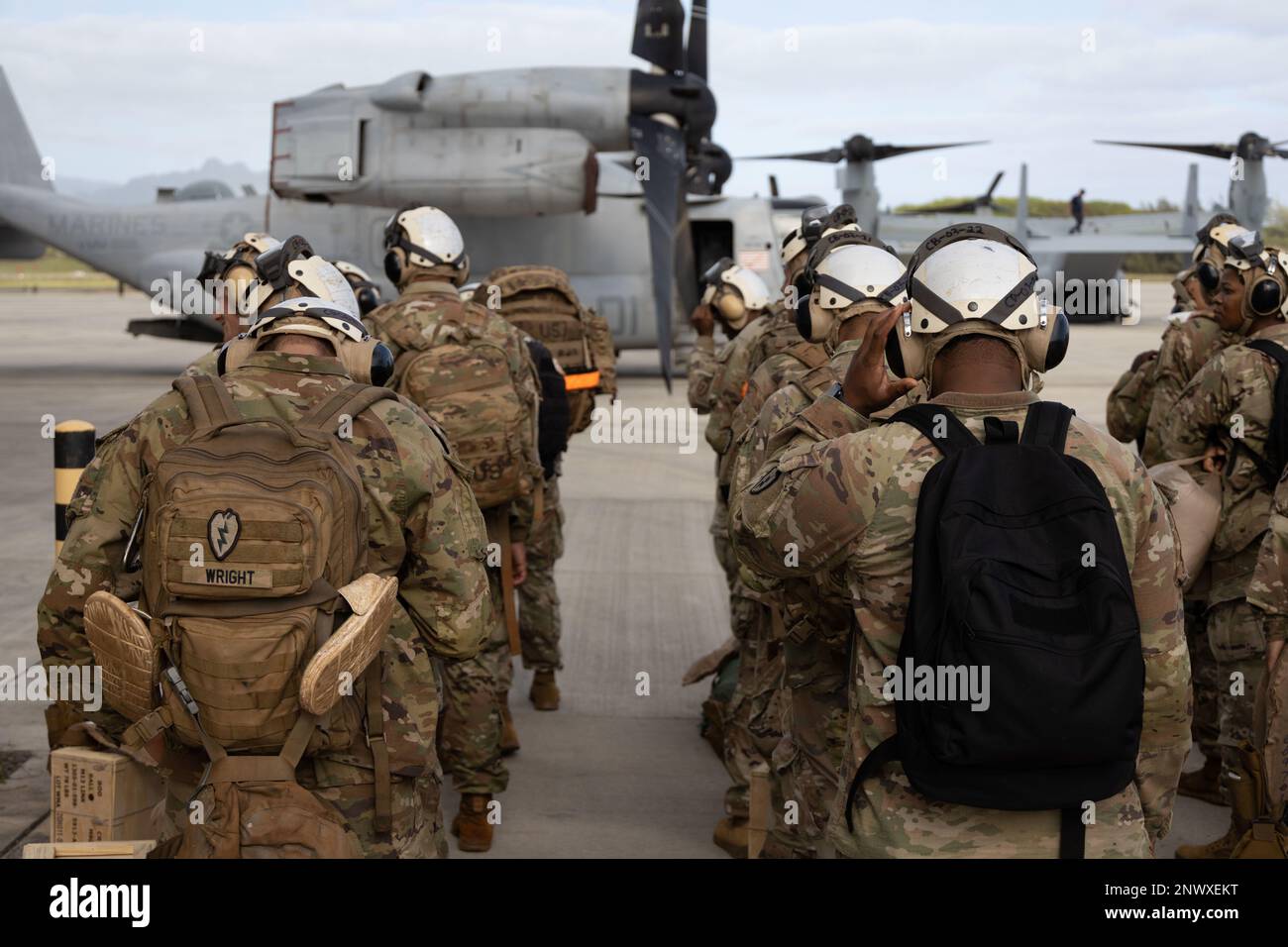 U.S. Army Soldiers with the 25th Infantry Division prepare to embark an ...