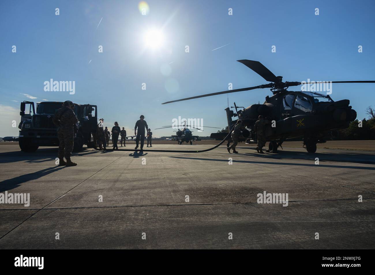 A U.S. Army AH-64 Apache refuels from a U.S. Air Force R-11 Mobile Fuel ...