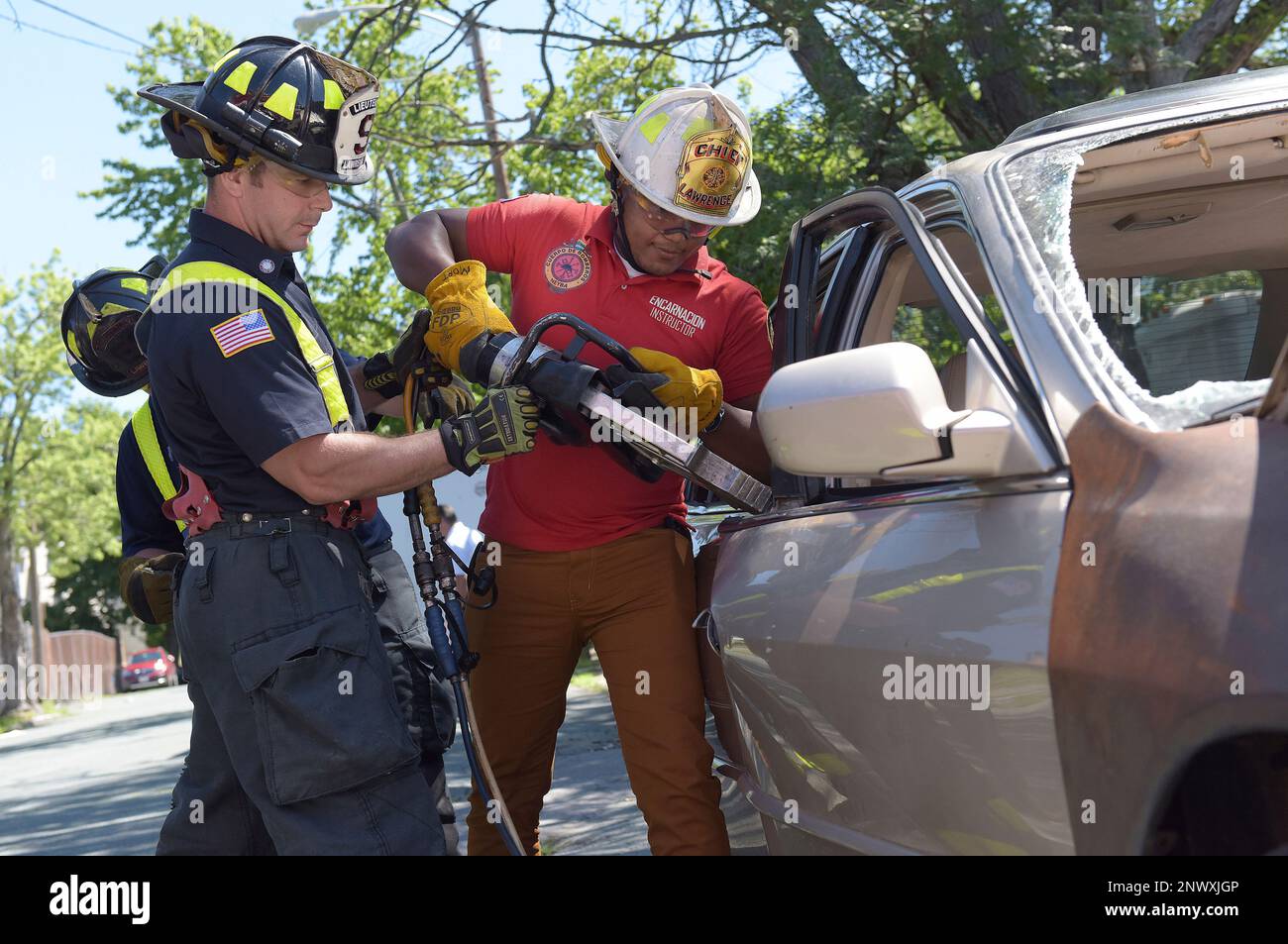 In this July 19, 2018 photo, Lawrence Fire Lt. Mike Maglio, left ...