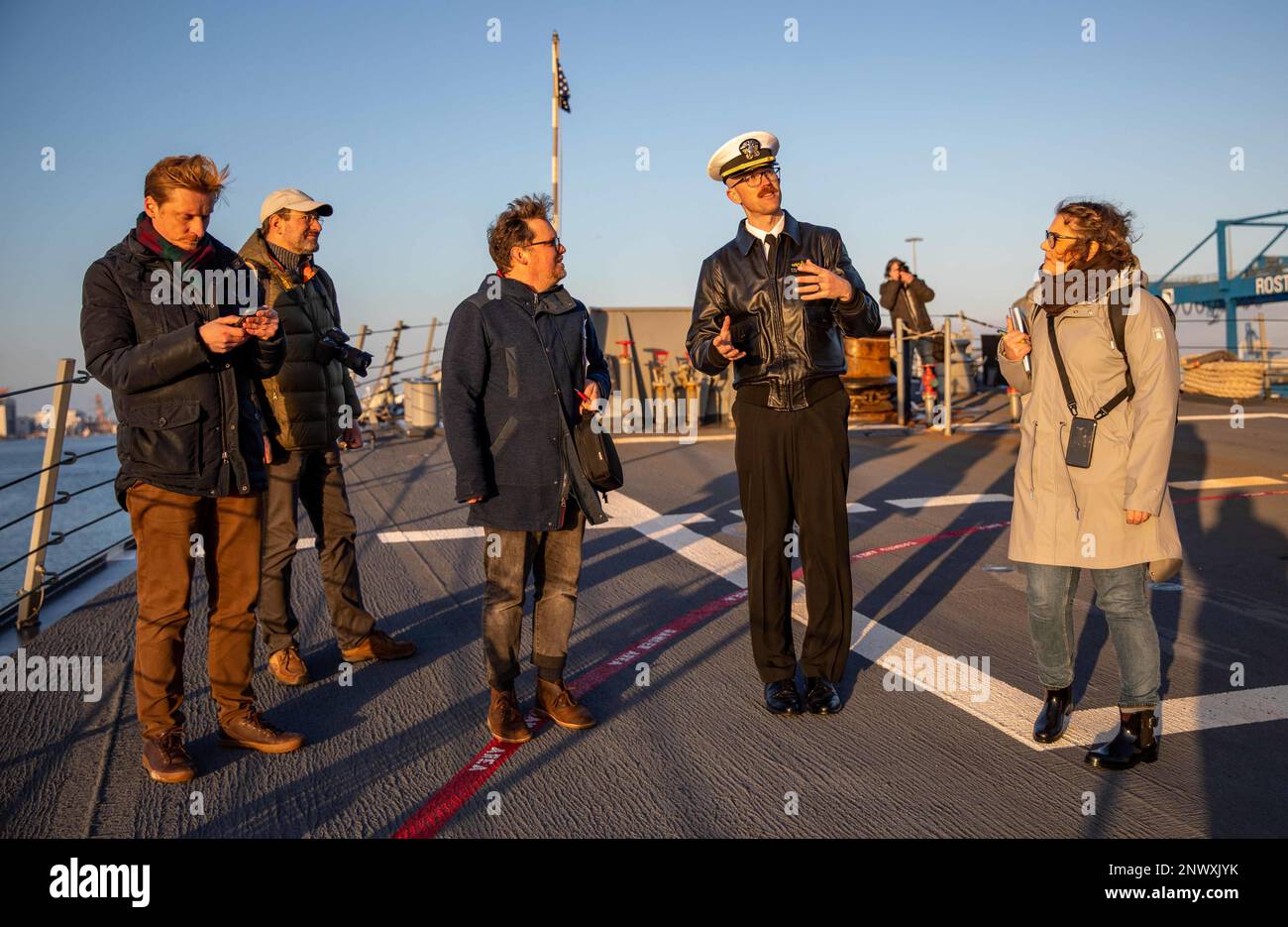 ROSTOCK, Germany (Jan. 9, 2023) Lt. Cmdr. Kyle Wagner, middle right ...