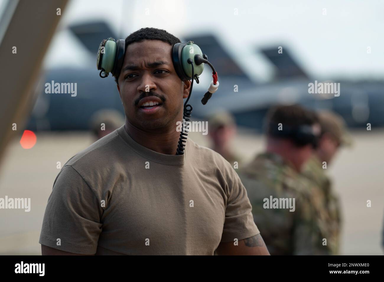 A U.S. Air Force Airman helps set up a mobile command and control point ...