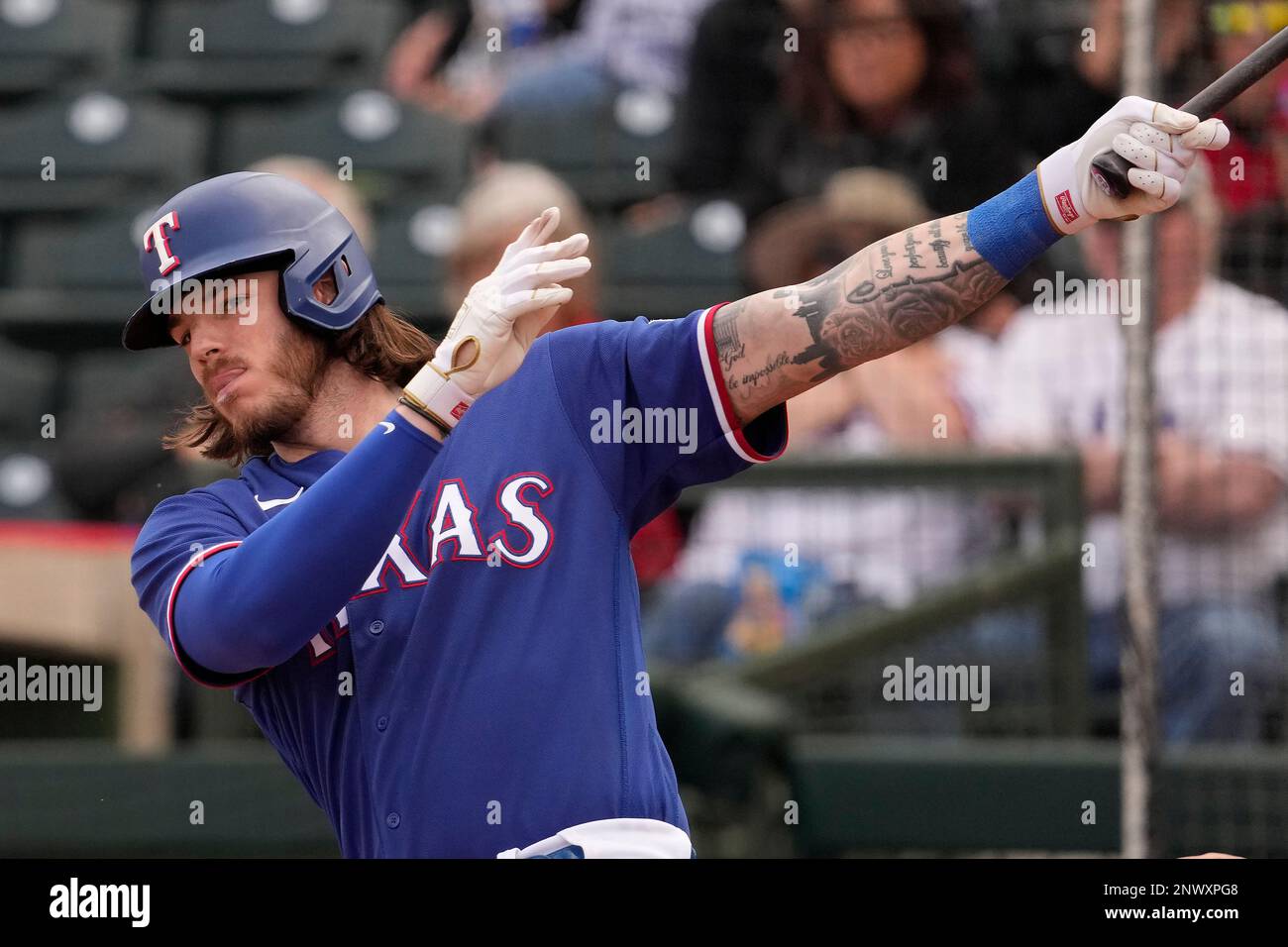 Texas Rangers' Jonah Heim bats during the first inning of a spring ...