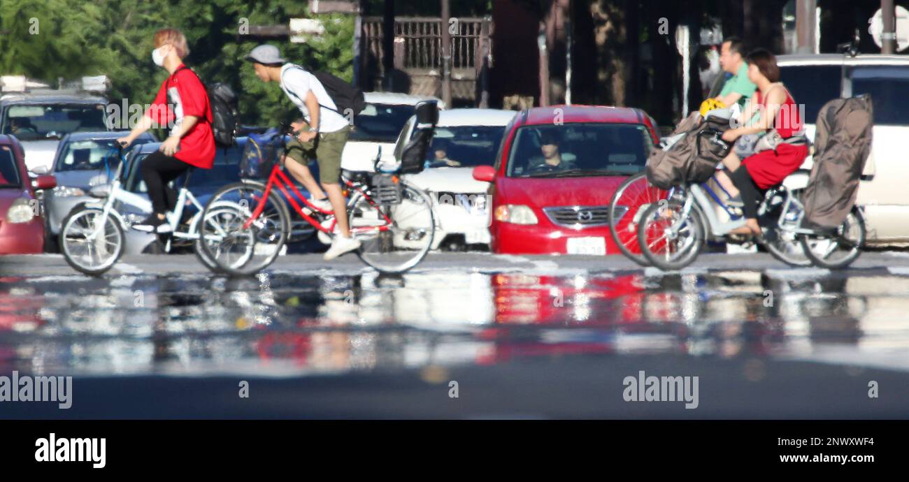 Road mirage is observed in hundred-degree weather in Nagoya City, Aichi ...