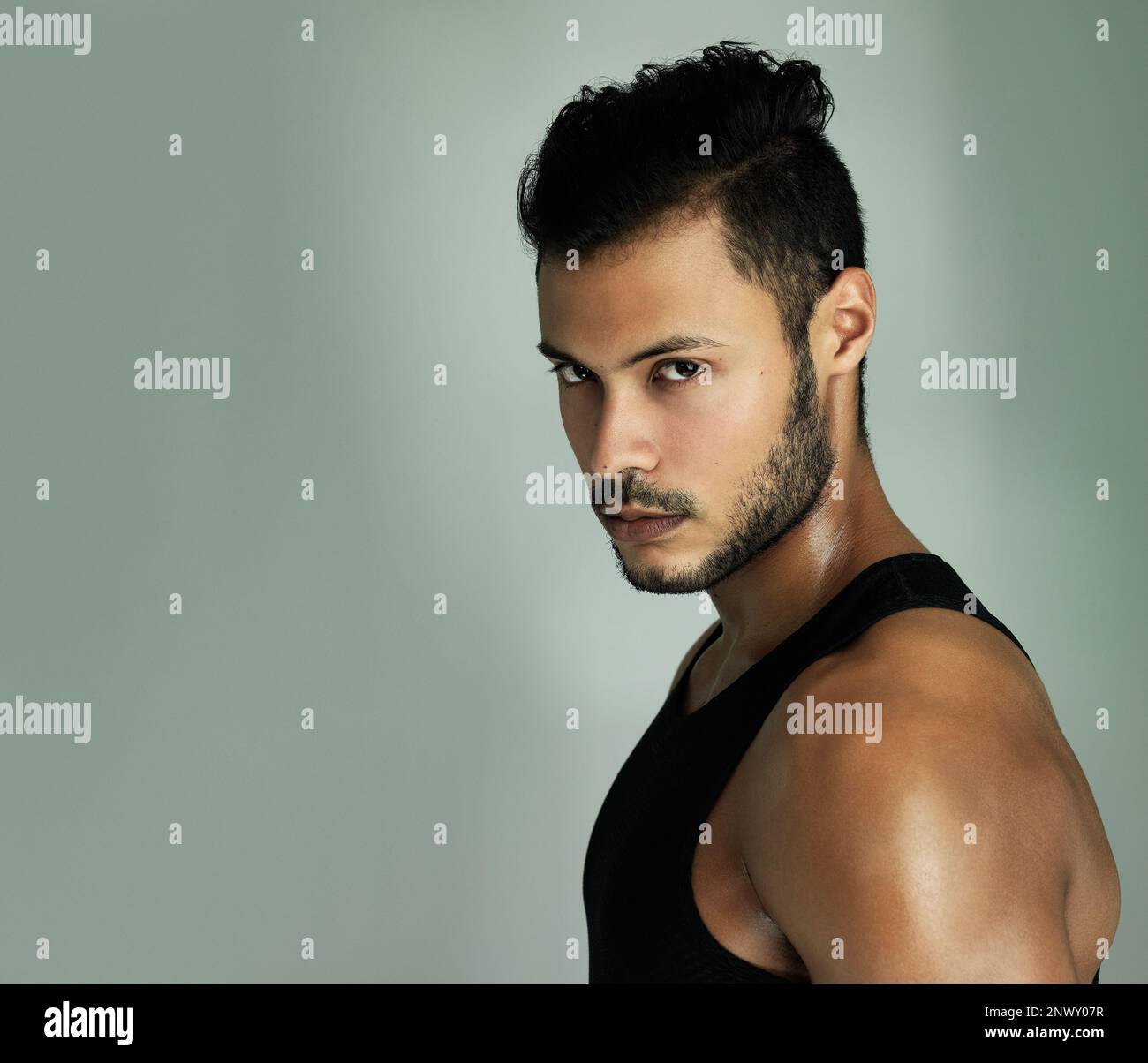 Feeling intimidated yet. Studio portrait of an athletic young man ...