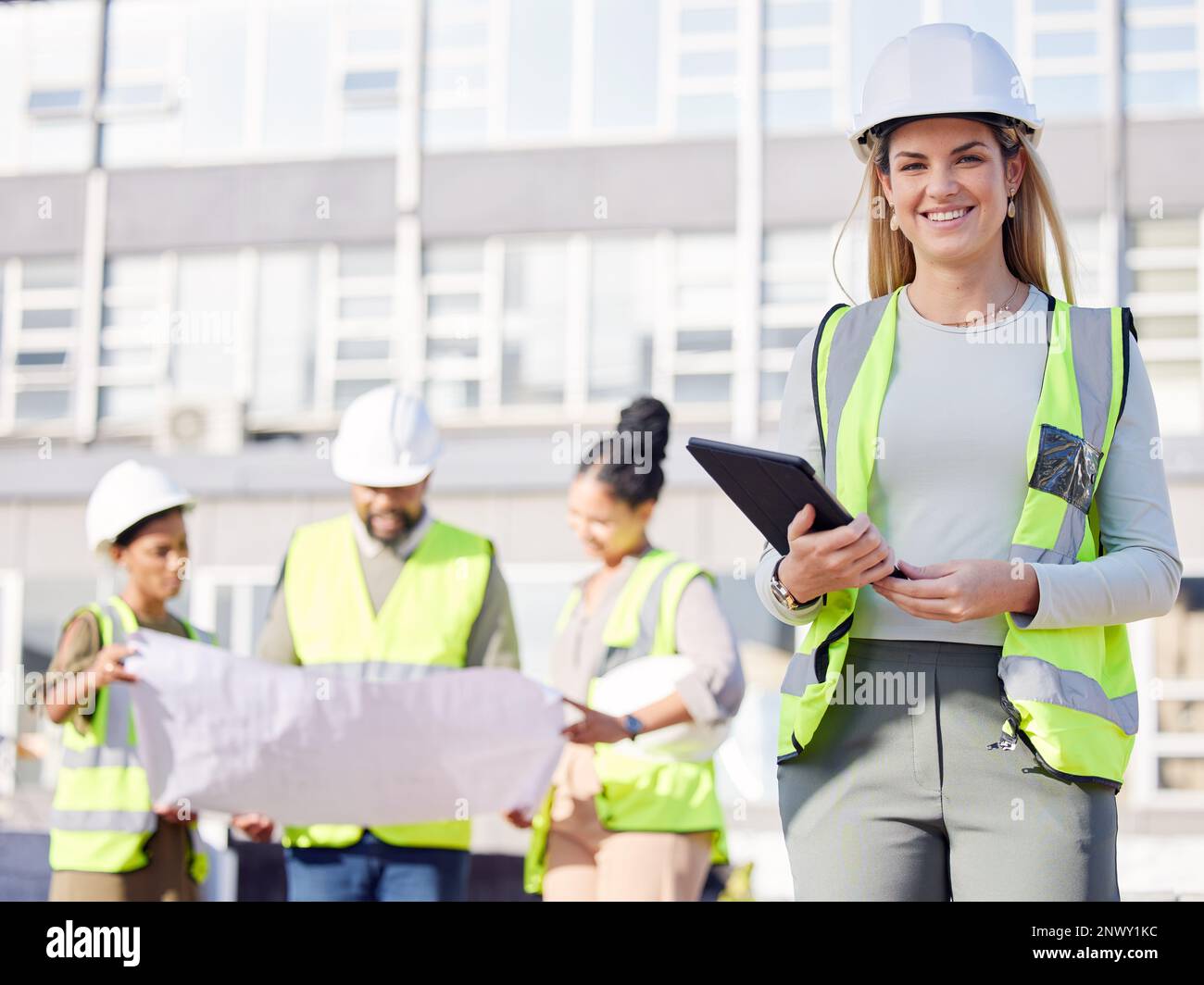 Architect, leader and woman construction worker with tablet, smile in ...