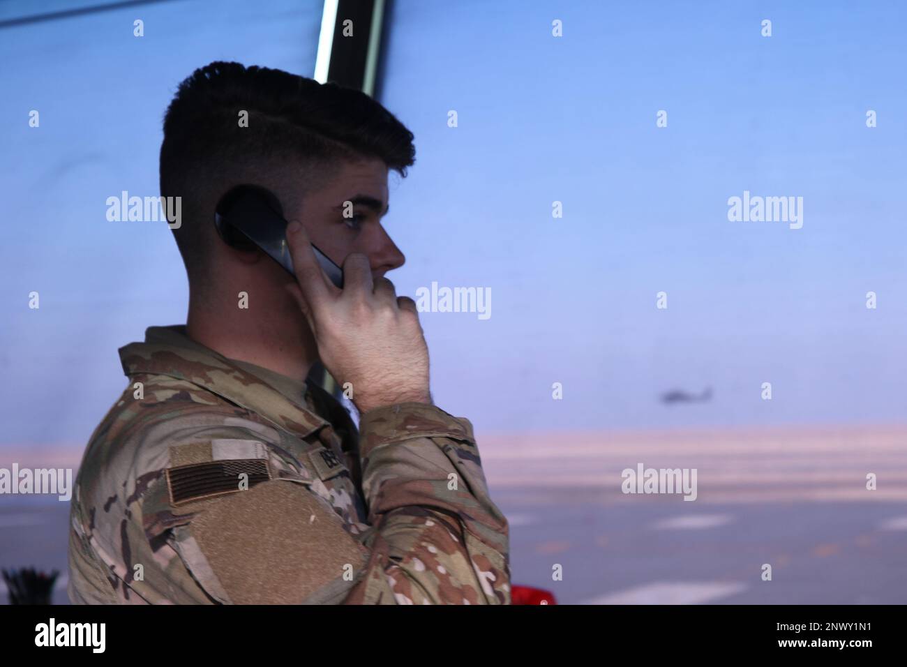 U.S. Army Spc. Isaac Bernardy, ATC from F/2-149th GSAB, calls in an air traffic control ...