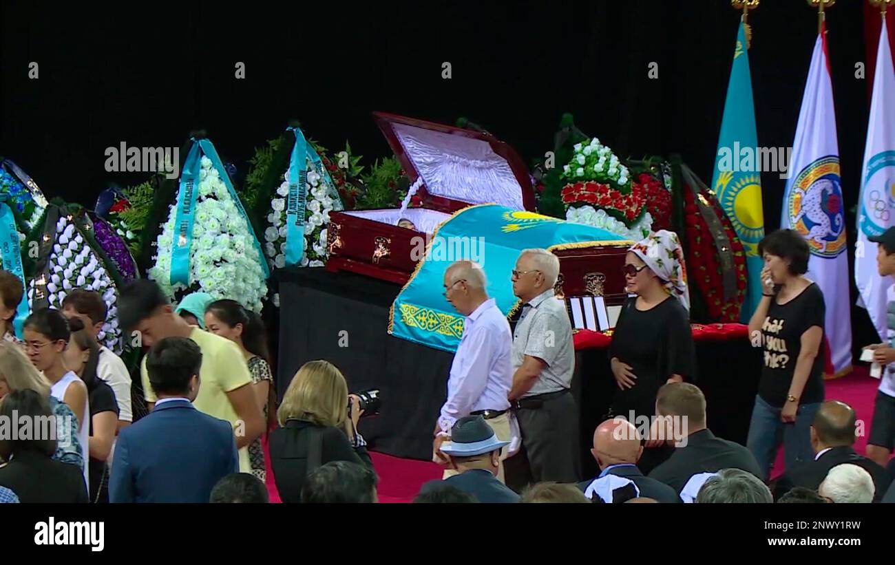 In this image made from TV, guests bid farewell as they file past the ...