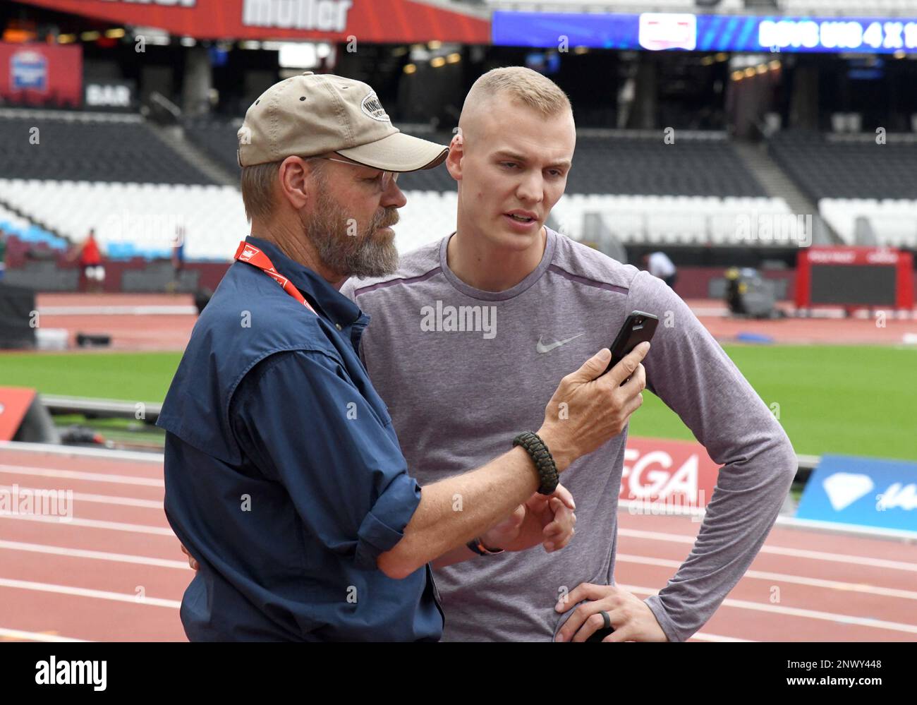 Sam Kendricks (USA), right, talks with father and coach Scott Kendricks ...