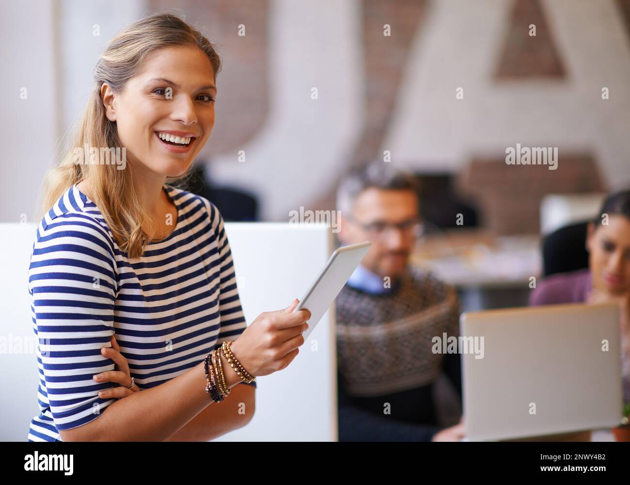 My tablets helped me to increase my productivity. a young businesswoman ...