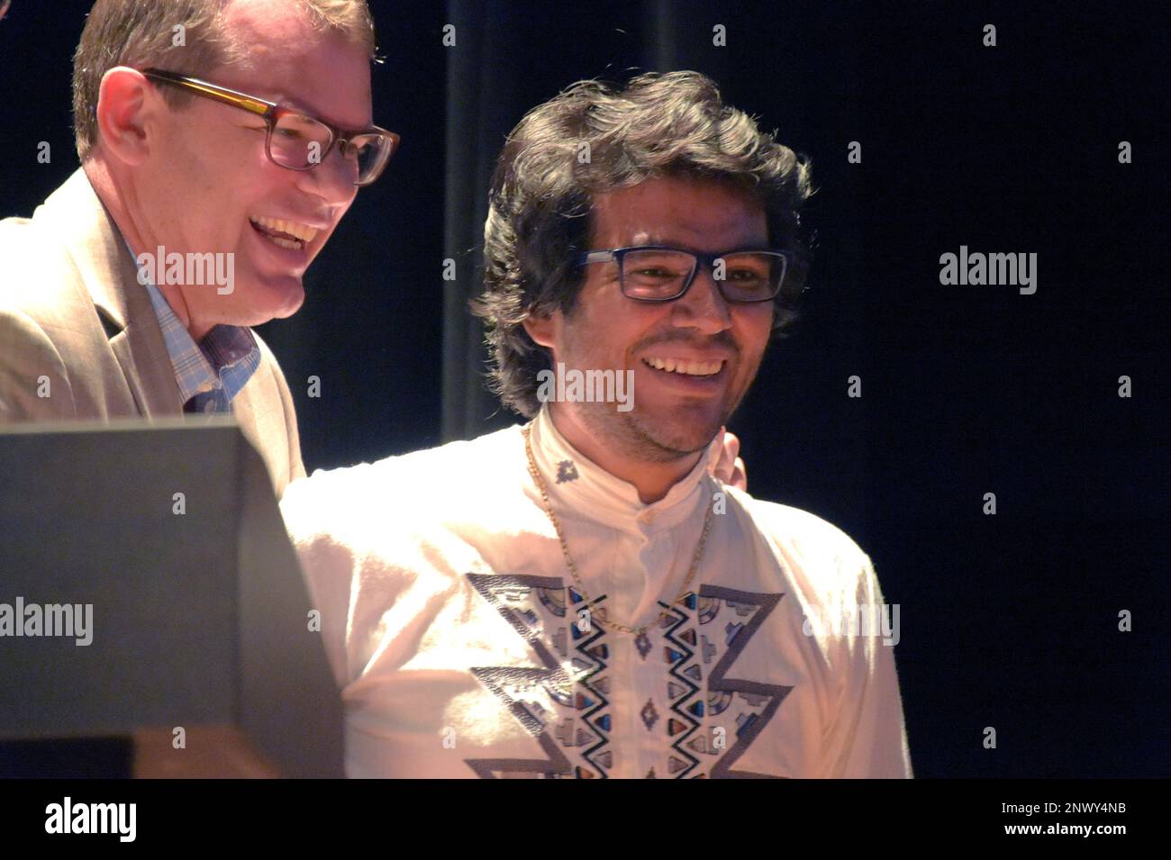 This July 14, 2018 photo, Jack Lewin of M&T Bank, left, smiles as Erick Antonio Benitez reacts ...