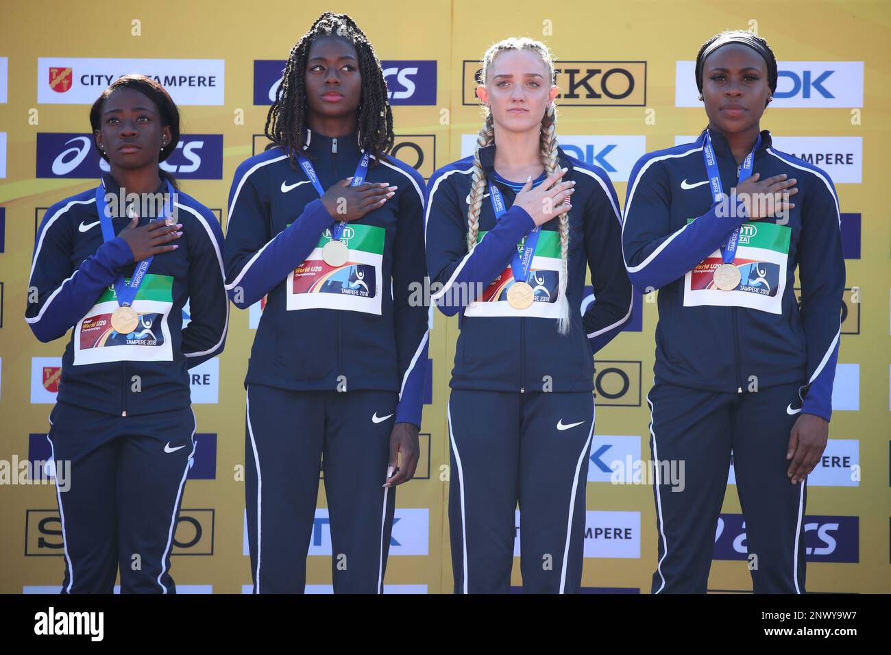 Members of the United States women's 4 x 400m relay pose with gold ...