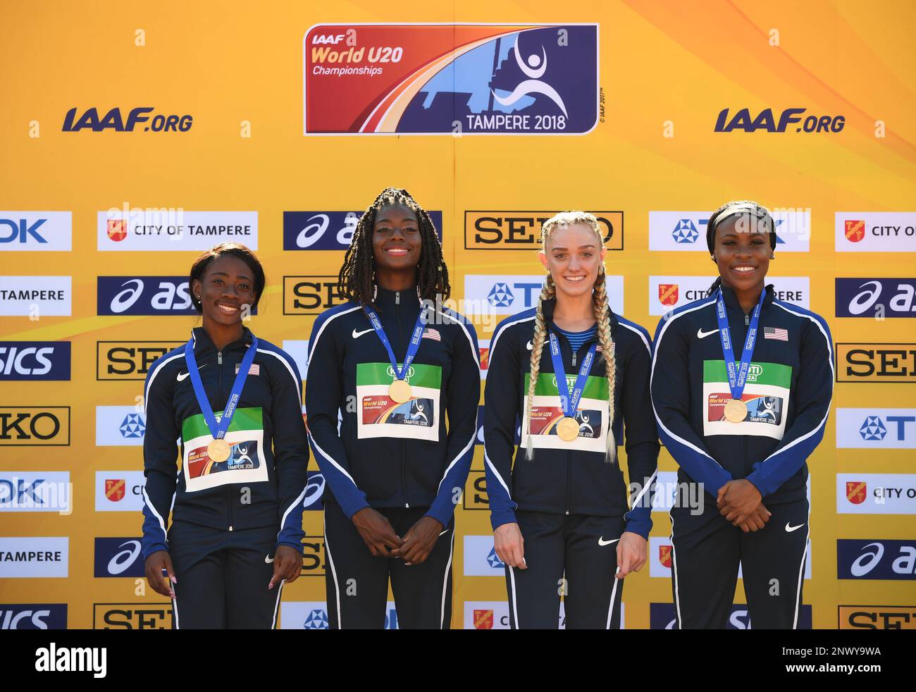 Members of the United States women's 4 x 400m relay pose with gold ...