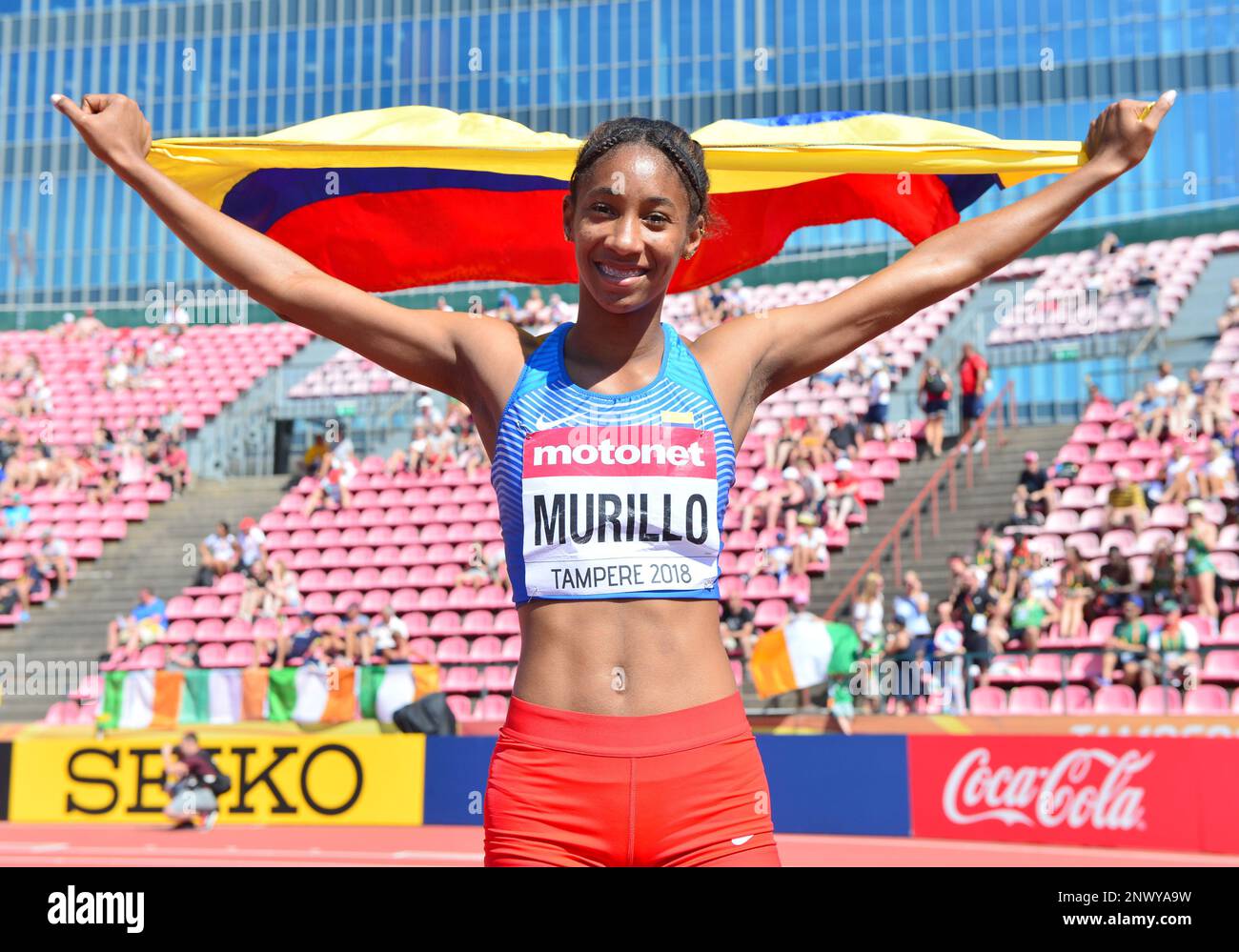 Women's high jump silver medalist Maria Fernanda Murillo (COL) poses with Colombian flag during ...