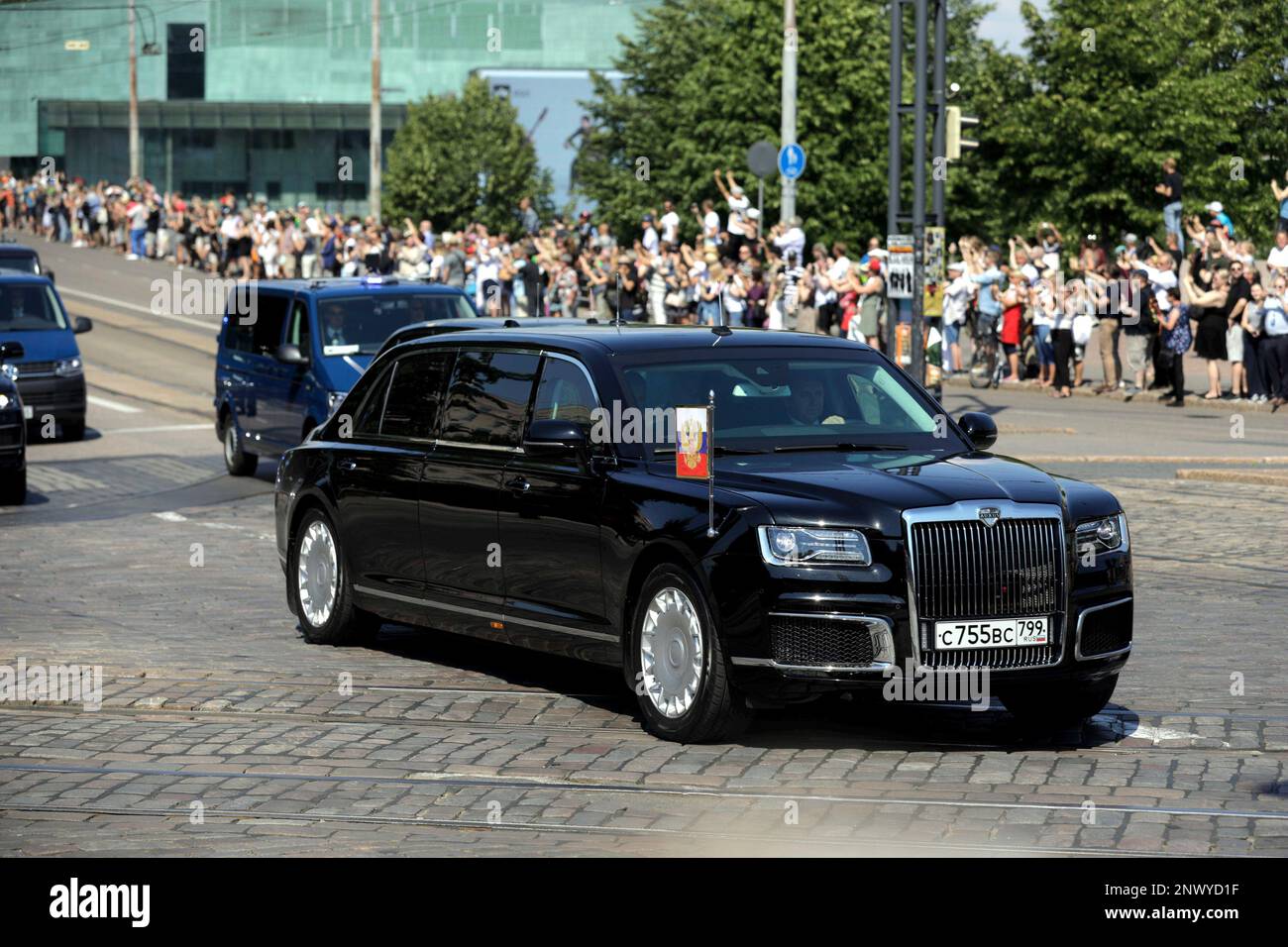 The motorcade and Kortezh limousine carrying the Russian President ...