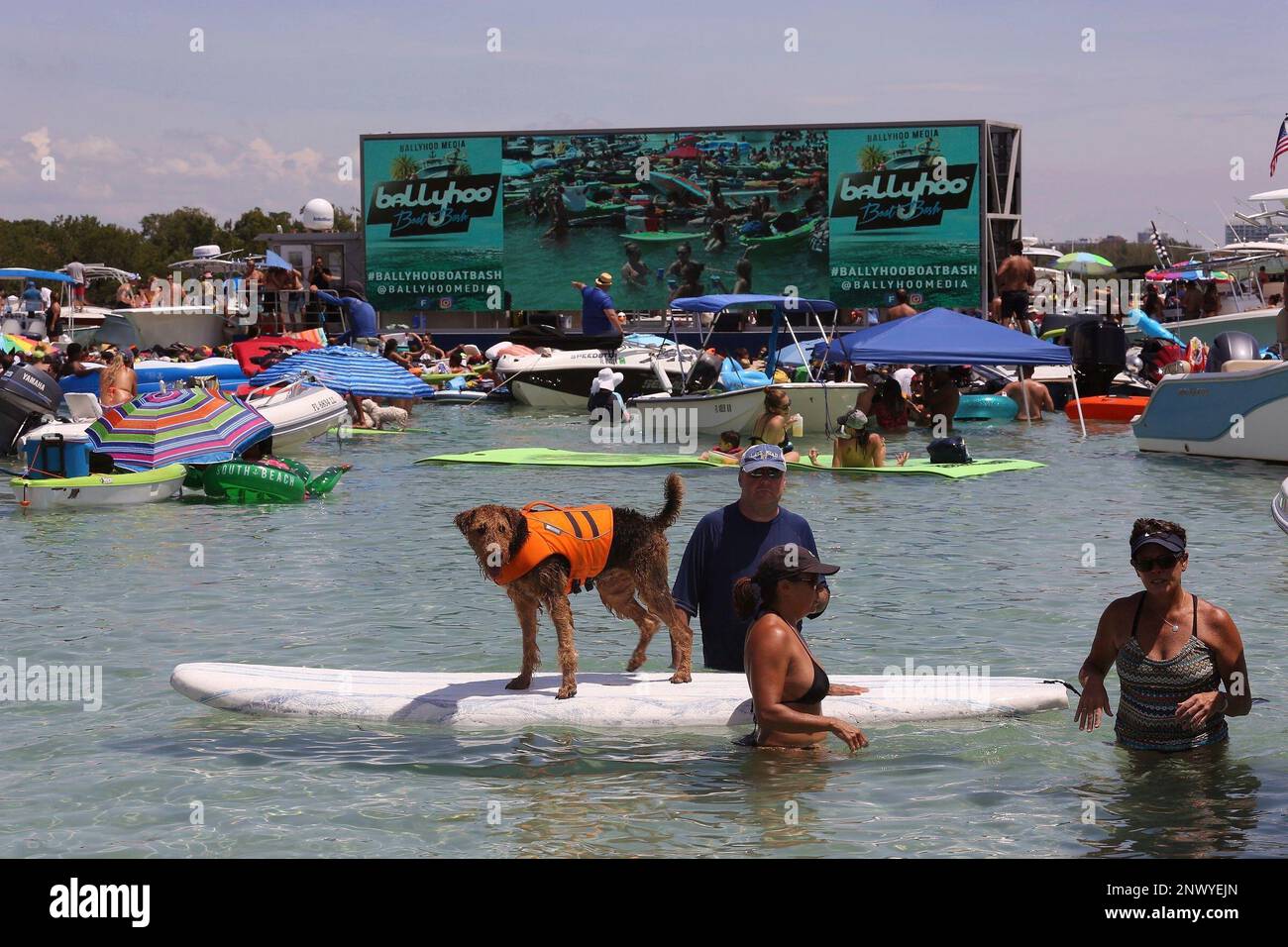 Soccer fans cool off in the water while they attending the "Ballyhoo ...