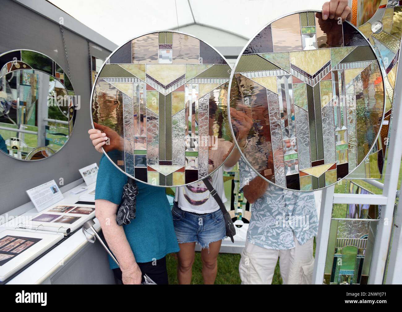 Artist Alan Sievers, right, of Batavia, Ill, shows off stained glass ...