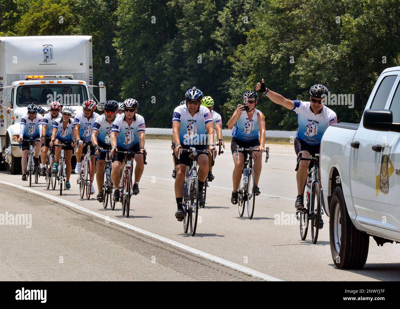 The Cops Cycling for Survivors group arrives at Center Ridge Cemetery ...