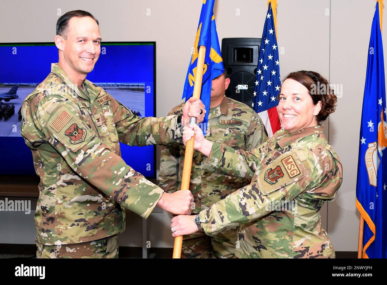 (left) Col. Benjamin Harrison, 301st Fighter Wing commander, passes the ...