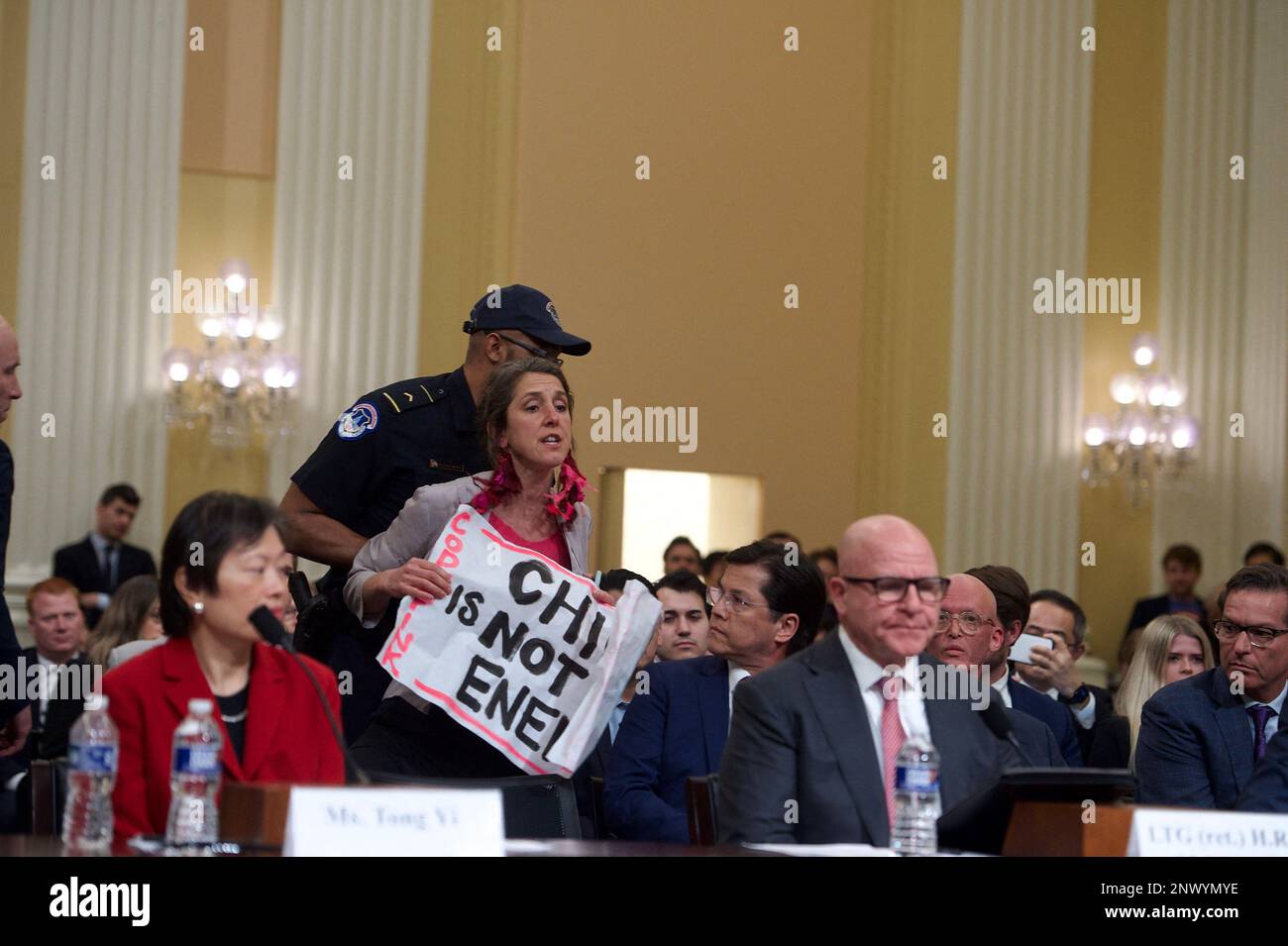 A protestor is removed from the room as Lieutenant General H.R ...