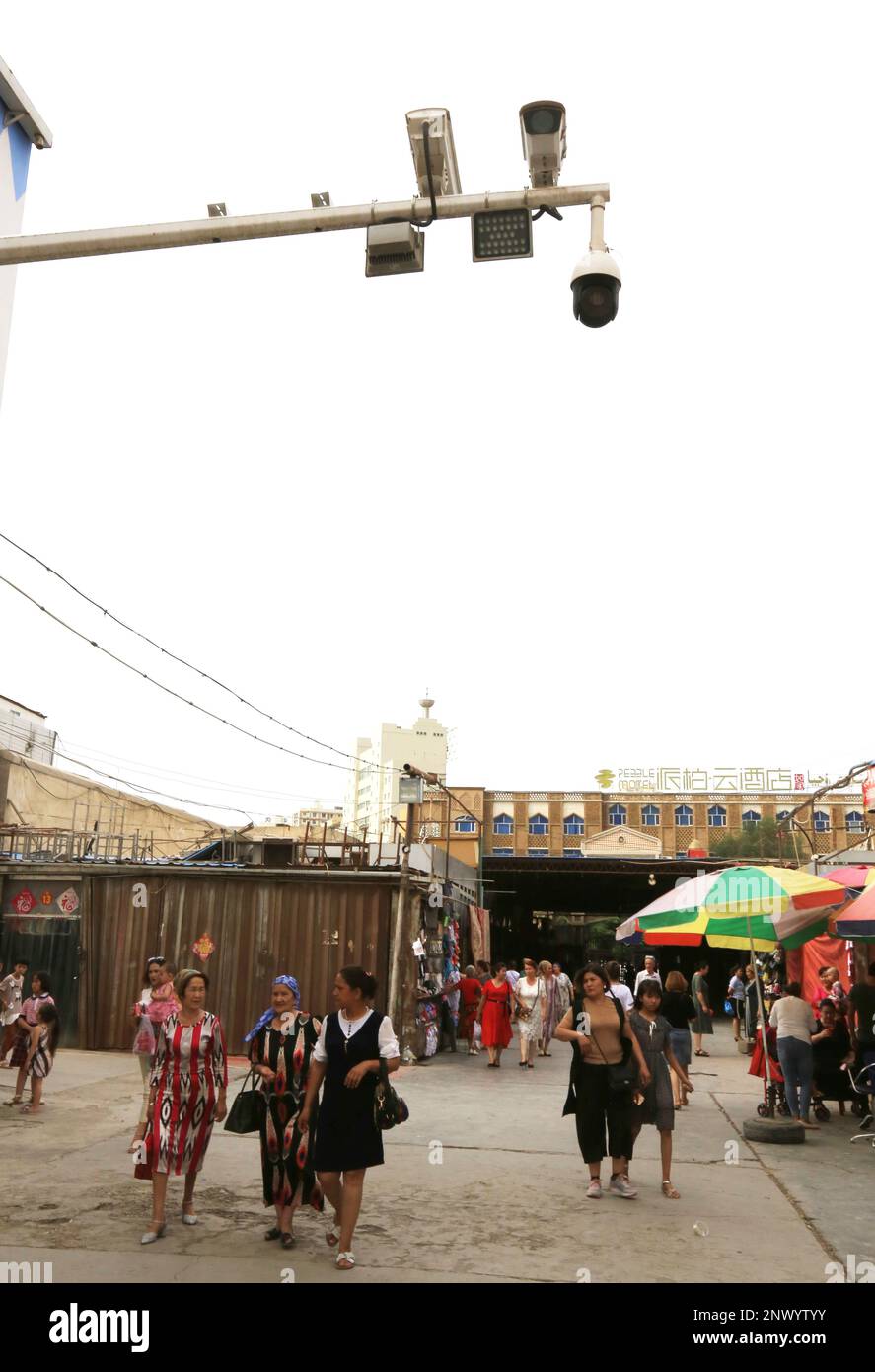 Monitoring cameras are set at a market in Turpan, the Xinjiang Uyghur ...