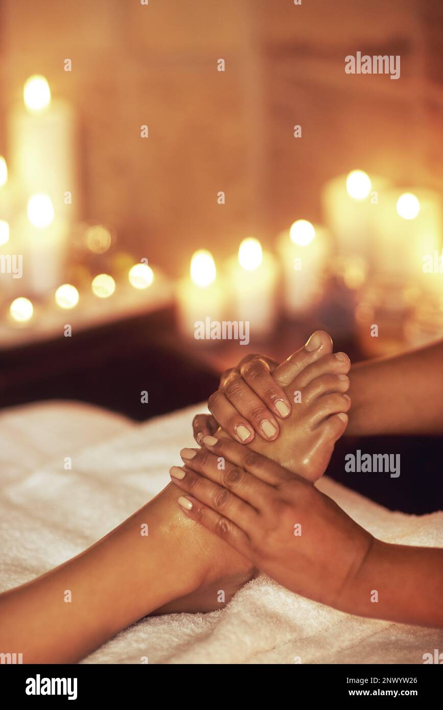 Put your feet up and just relax. a woman enjoying a foot massage at a ...