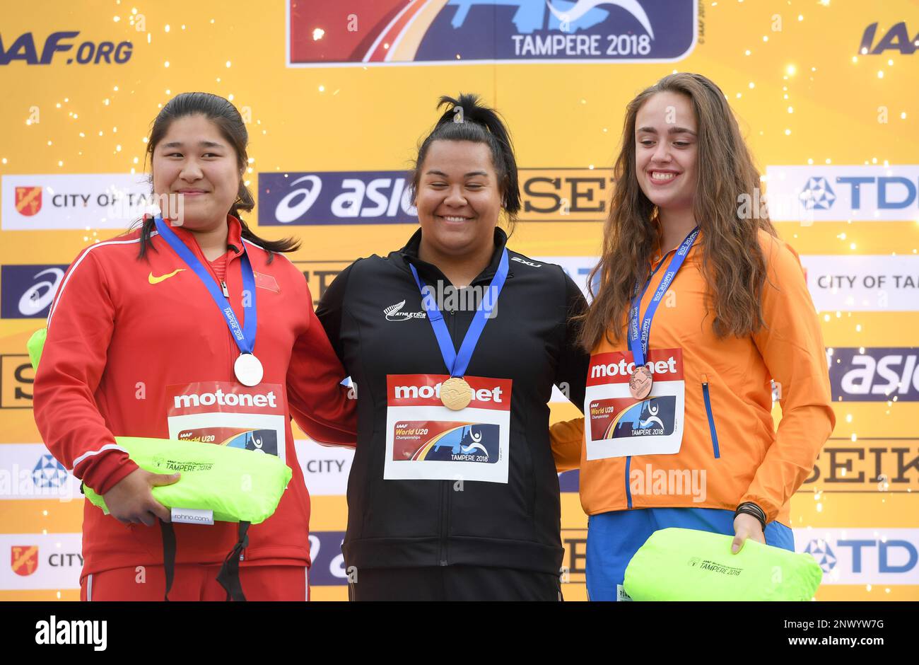 Women's shot put gold medalist Madison-Lee Wesche (NZL), center, poses ...