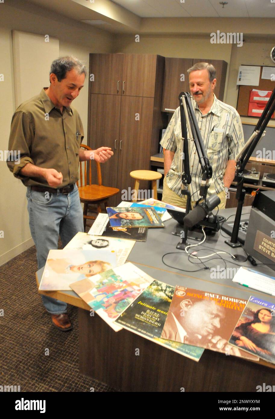 Alex Henderson looks over a portion of records collected by a WWII ...