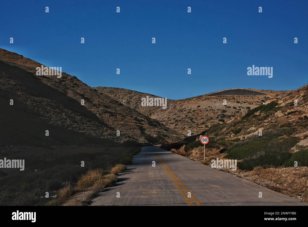 View of an empty road on the island of Ios Greece and a speed limit ...