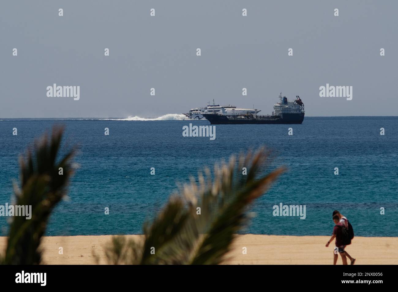 Ios, Greece : May 29, 2021 : View of tourists walking on the Mylopotas ...