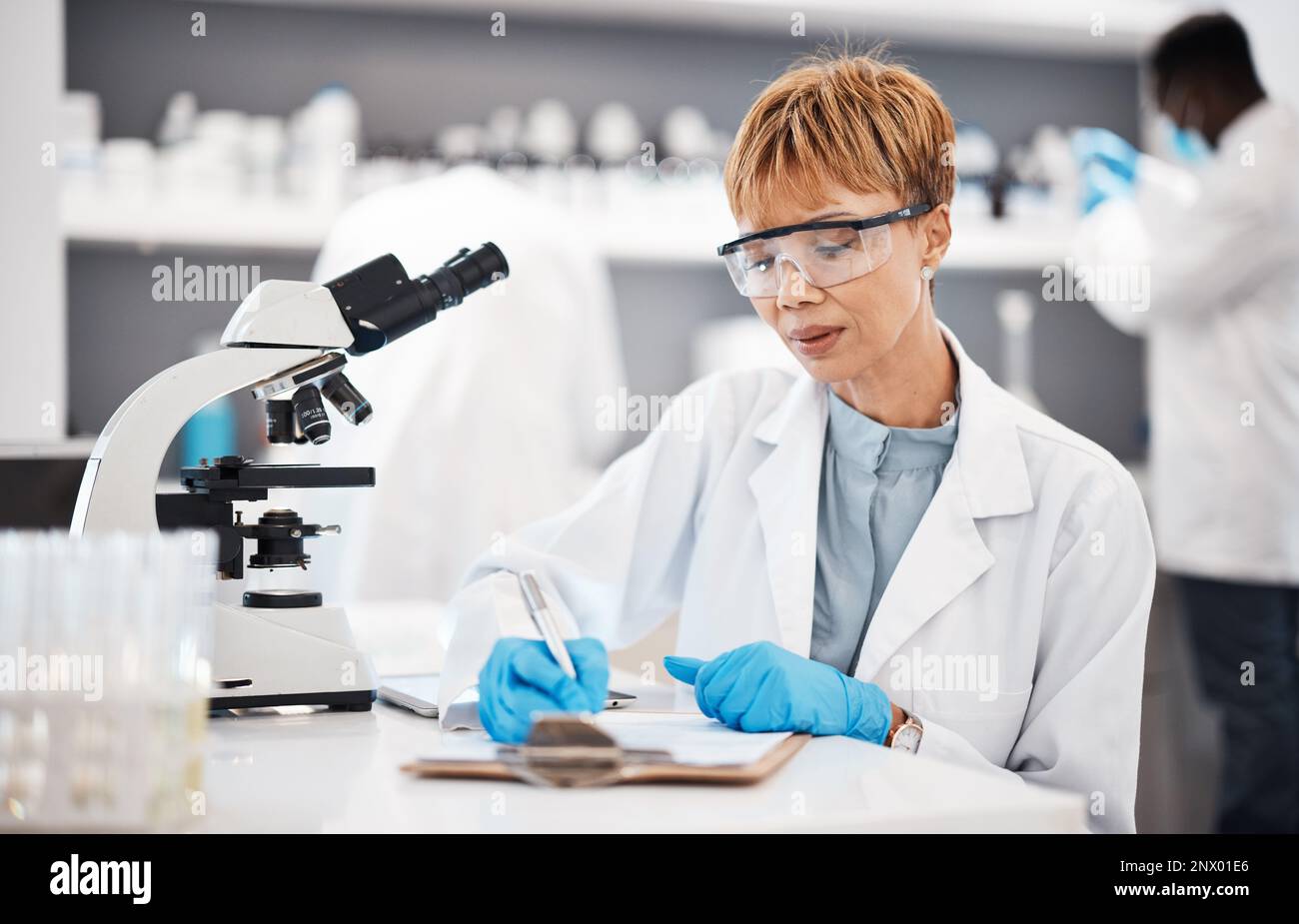 Scientist, woman and writing lab report with results, focus or analysis ...