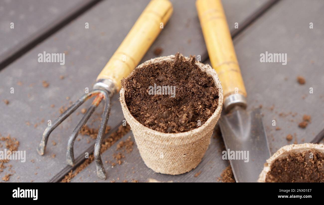 Close up of eco friendly biodegradable peat pots and garden tools, top ...