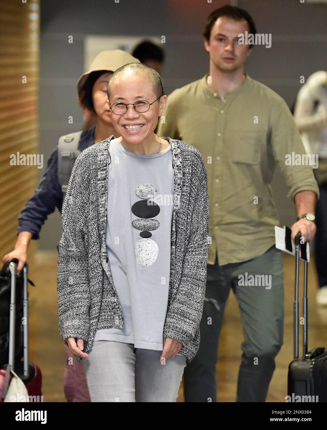 Liu Xia, the widow of Chinese Nobel dissident Liu Xiaobo, reacts as she ...