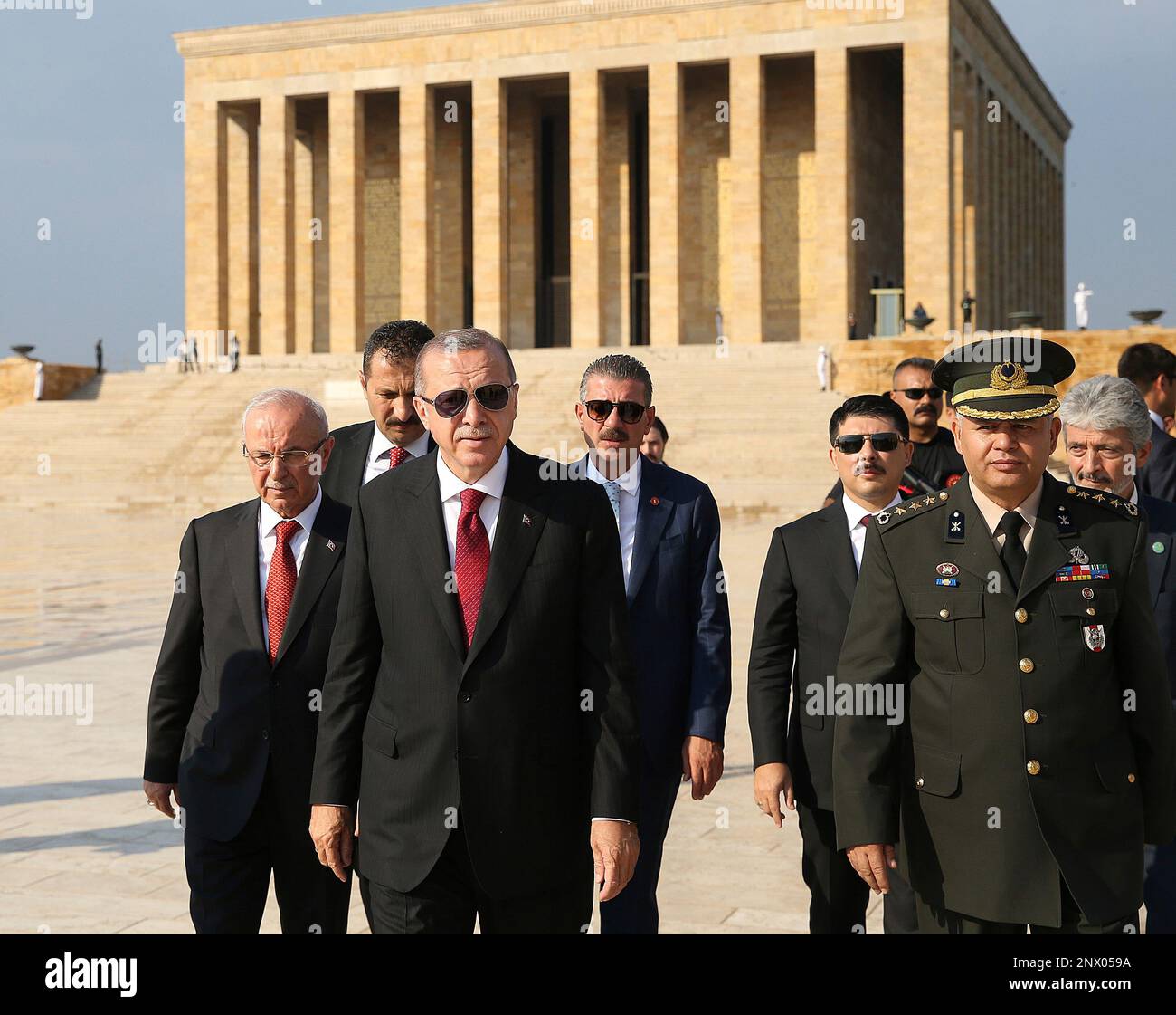 Turkey's President Recep Tayyip Erdogan, walks following a wreath ...