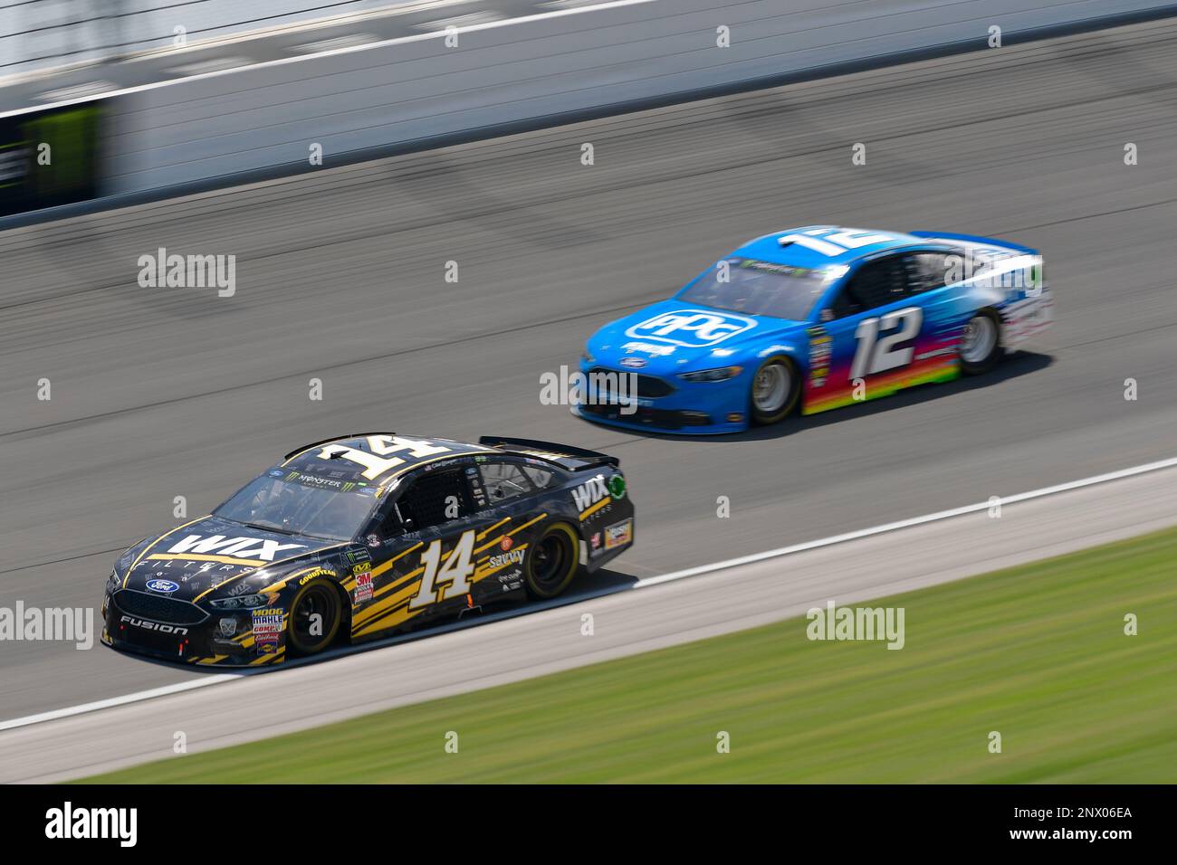 Clint Bowyer (14) and Ryan Blaney (12) during the Monster Energy NASCAR ...