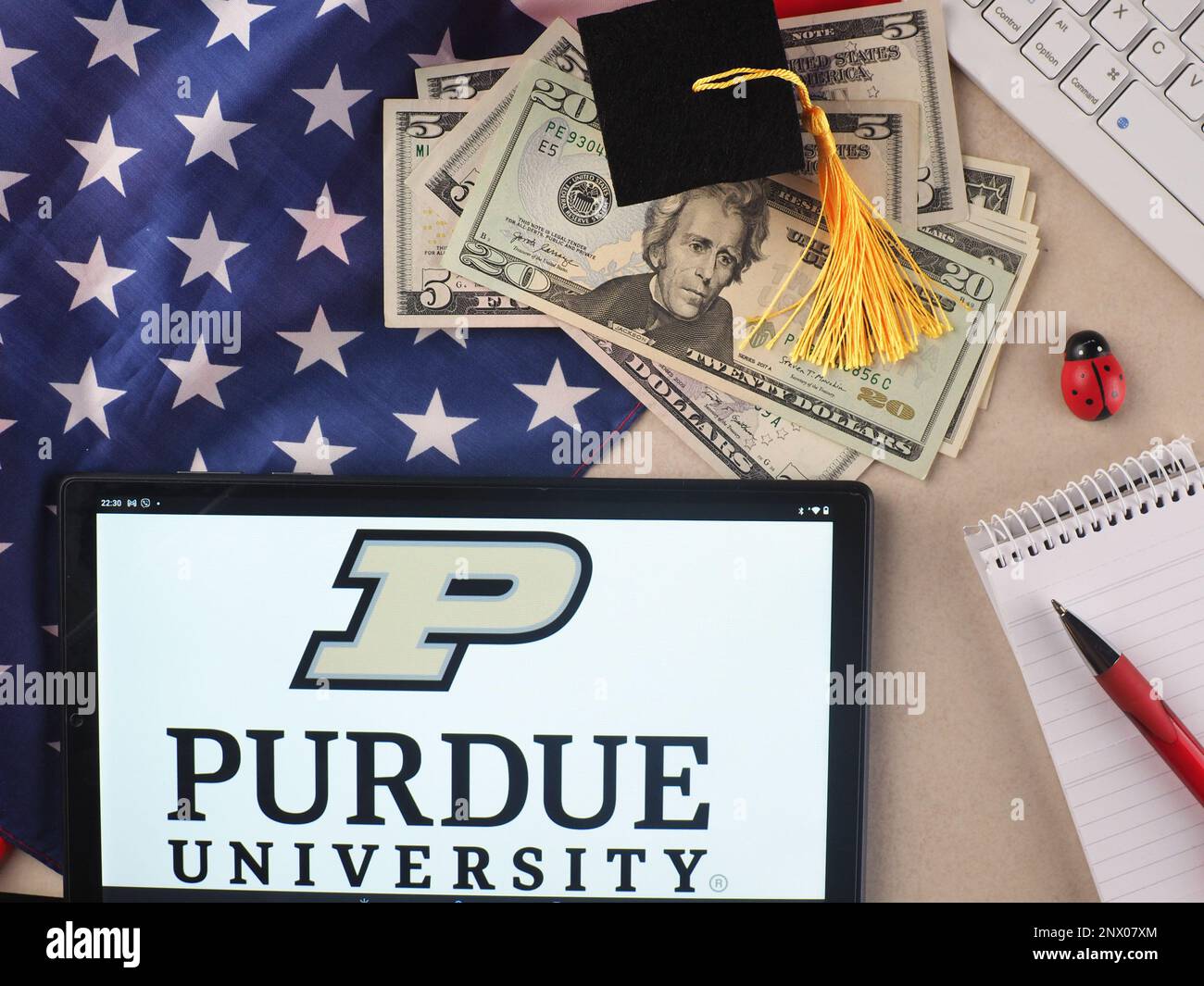 In this photo illustration, Purdue University logo seen displayed on a ...