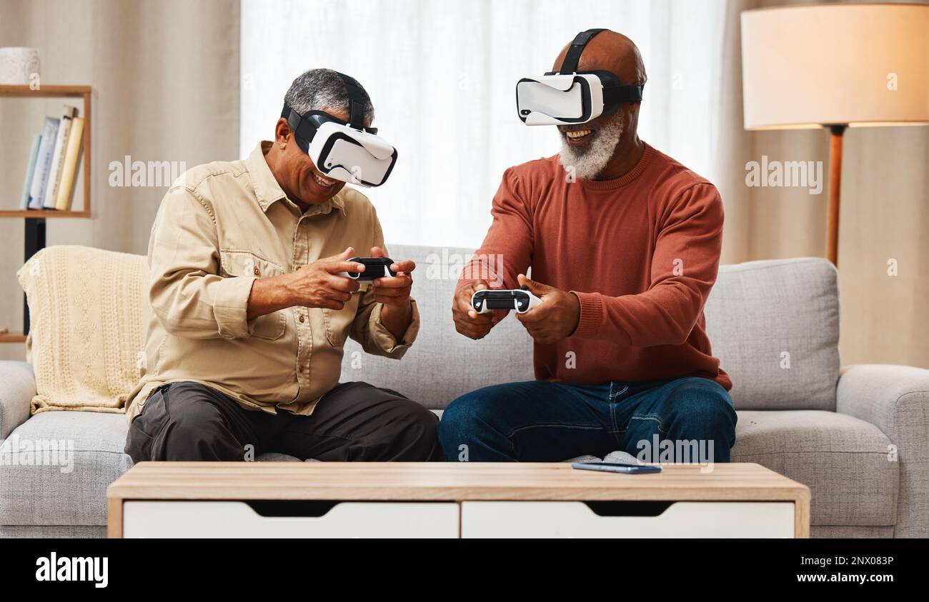 Vr, friends and senior men gaming in home on sofa in living room while ...