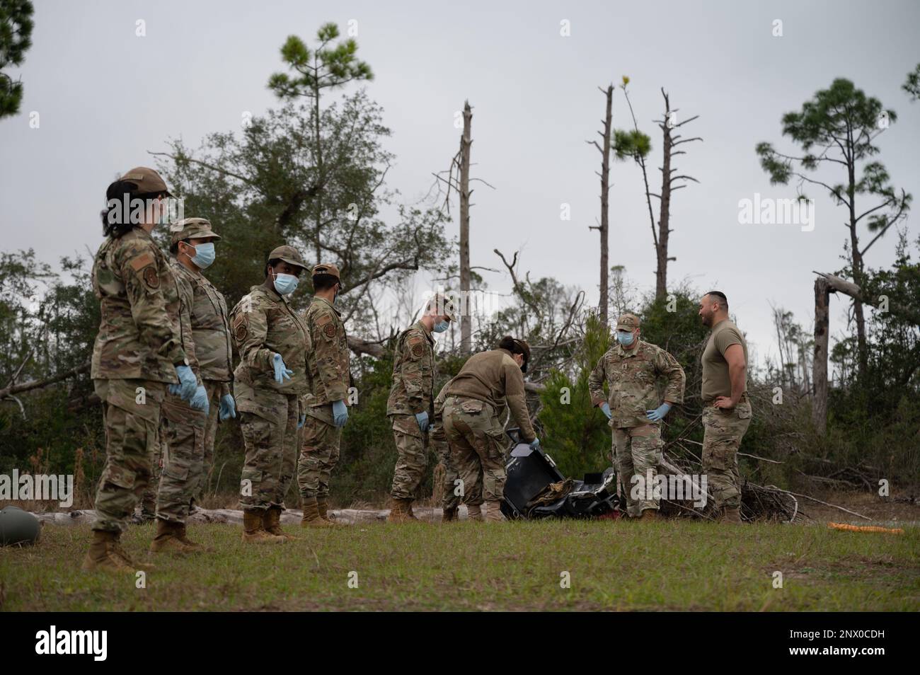 U.S. Airmen with the 325th Force Support Squadron perform a search and ...