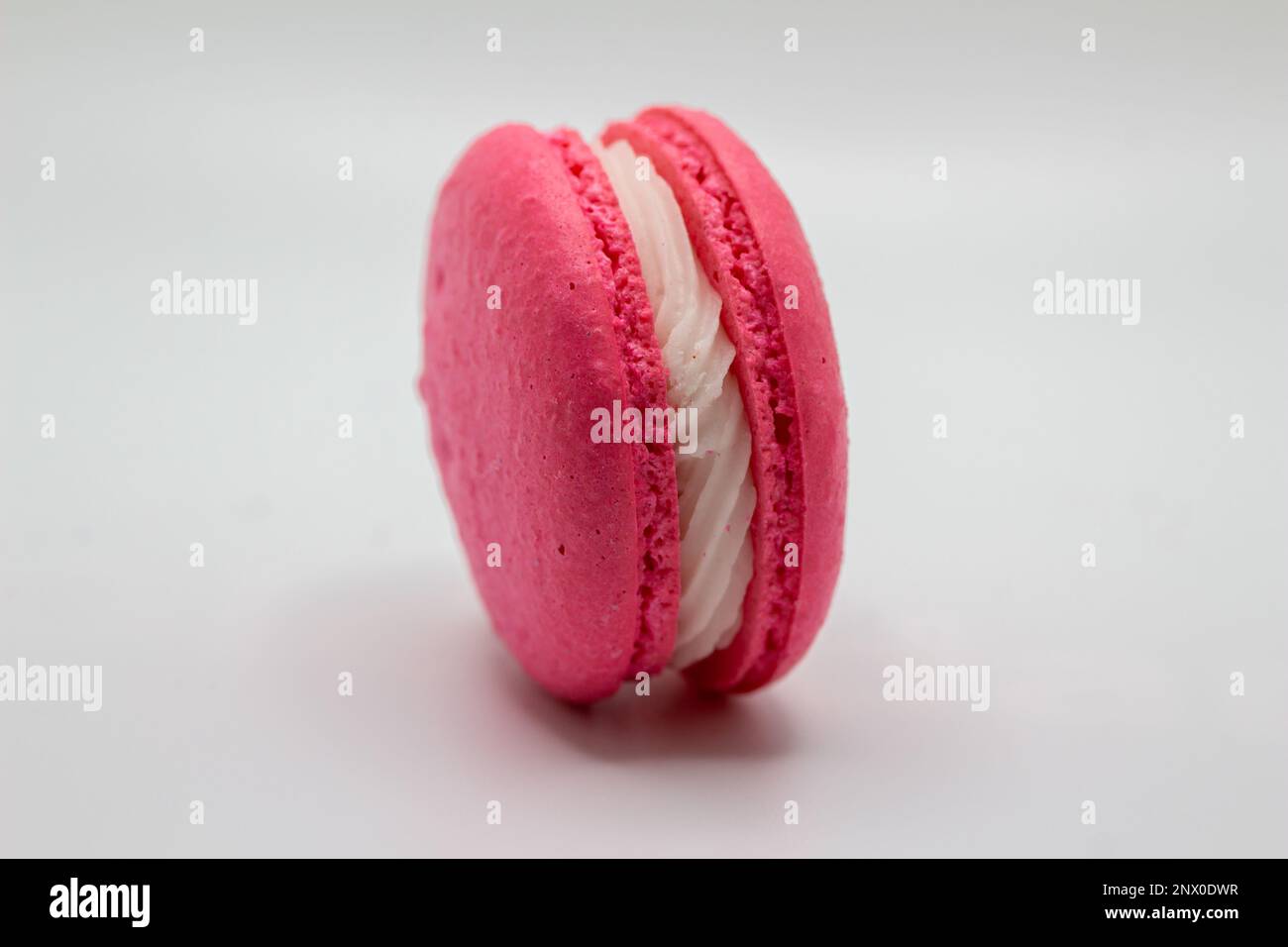 This image shows a close-up view of colorful French macaron confections ...