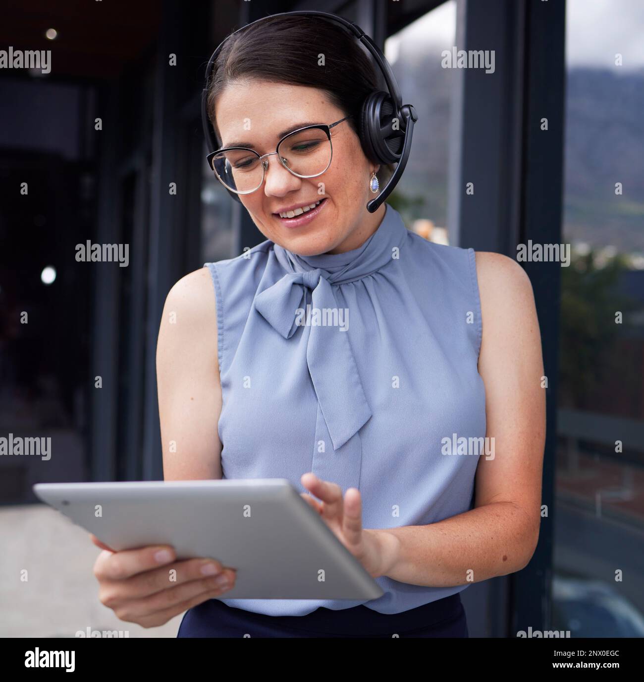 Tablet, customer support and service with a business woman doing a ...