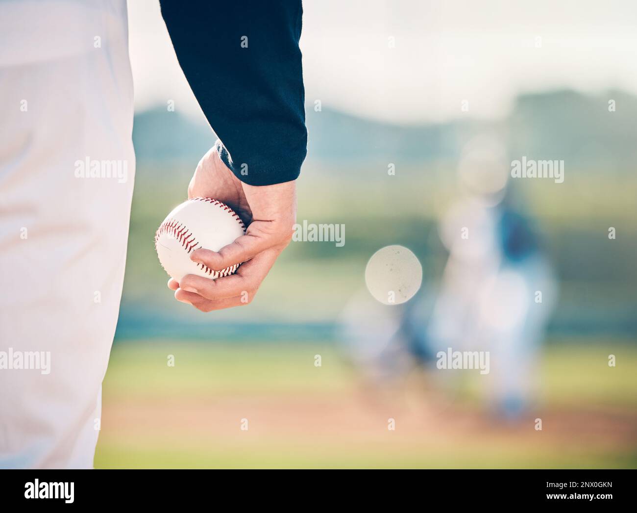 Baseball player, ball and athlete or pitcher hand in a competitive ...