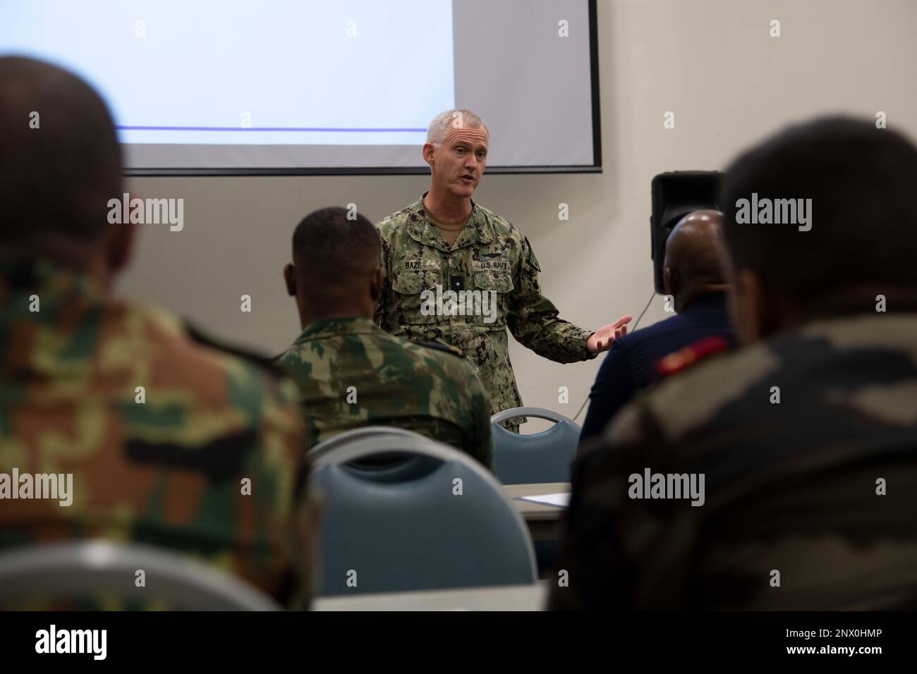 Rear Adm. Wayne Baze, Commander, Navy Personnel Command, speaks with ...