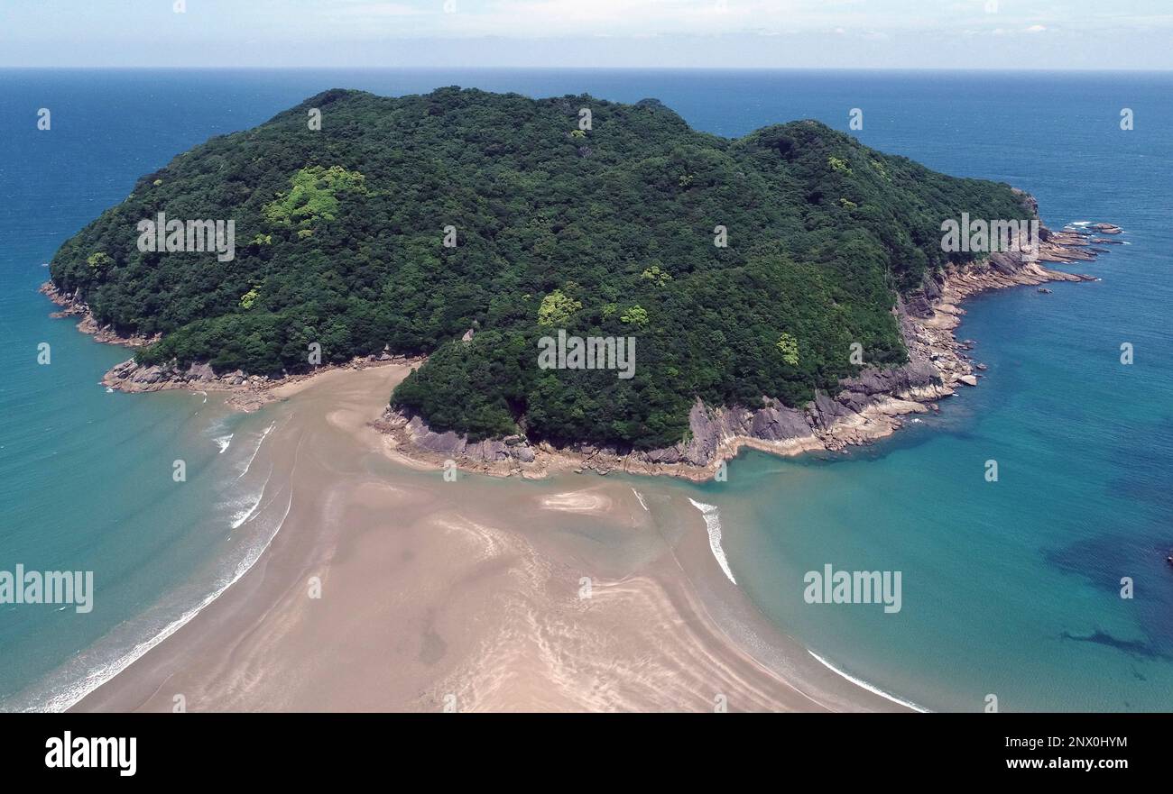 A picture shows Kojima Island connected by "sand road" to main land ...